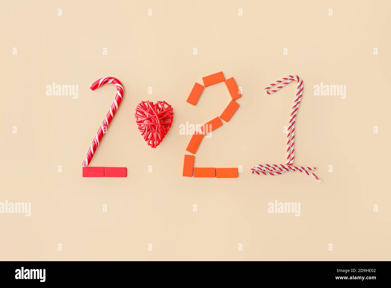 Composition with figure 2021 on color background Stock Photo - Alamy