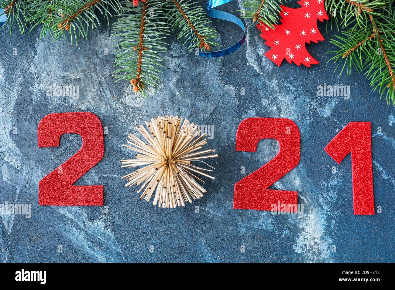 Figure 2021 and Christmas decor on color background Stock Photo - Alamy