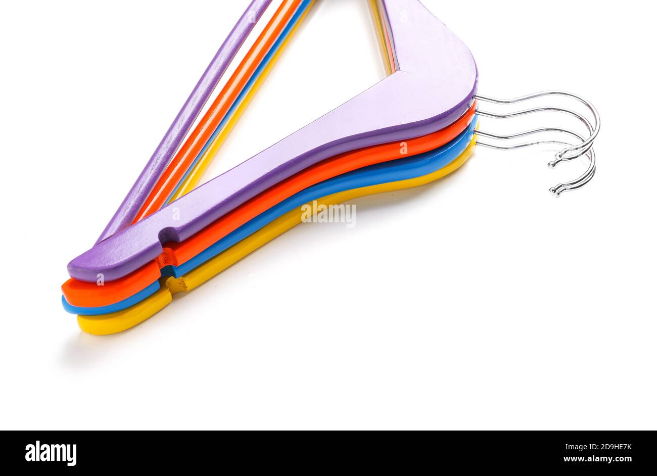 Clothes hangers on white background Stock Photo - Alamy