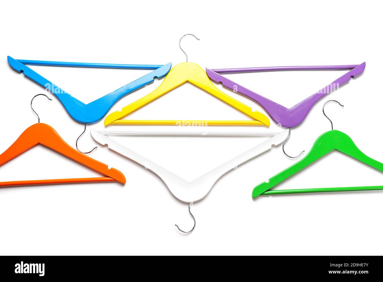Clothes hangers on white background Stock Photo - Alamy