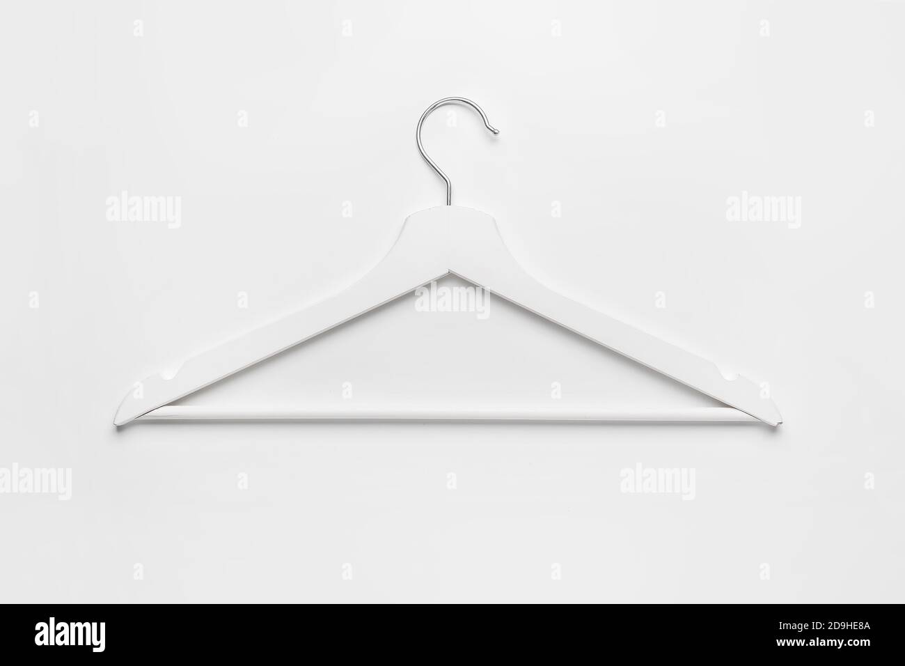 Clothes hanger on white background Stock Photo - Alamy