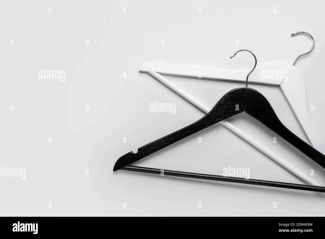 Clothes hangers on white background Stock Photo - Alamy