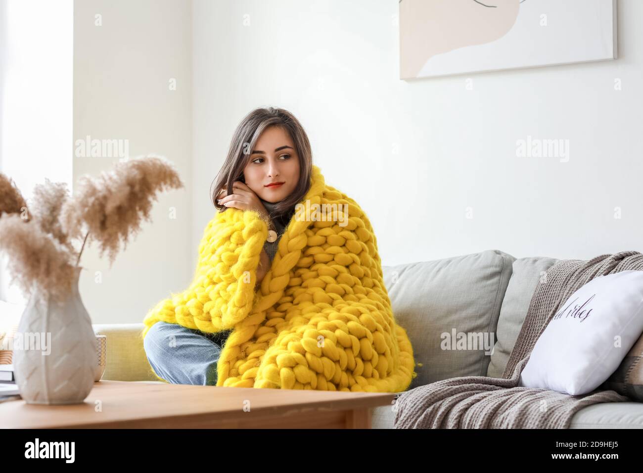 Beautiful young woman resting at home Stock Photo - Alamy