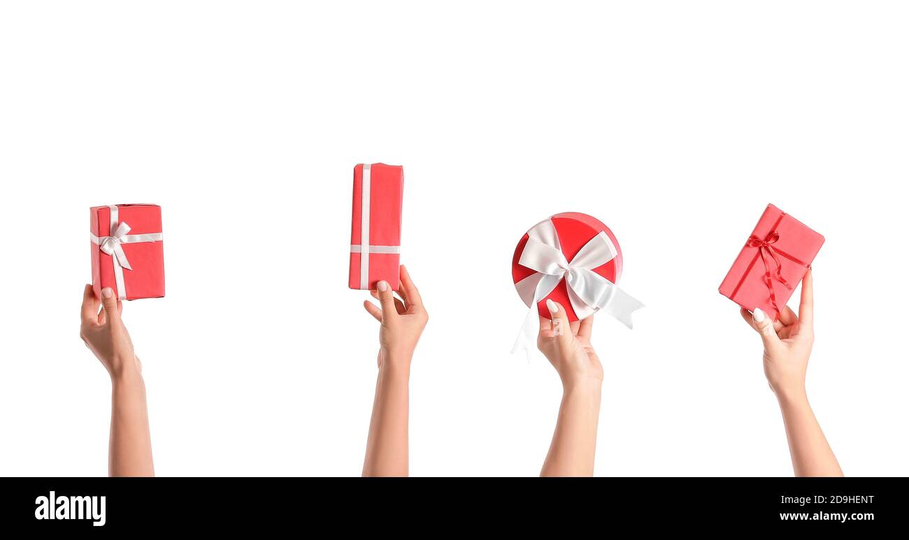 Hands with gift boxes on white background Stock Photo - Alamy