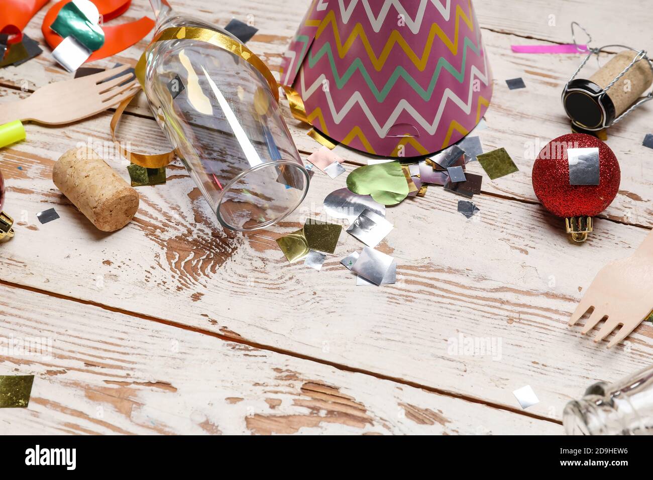 Mess after party celebration on wooden background Stock Photo - Alamy