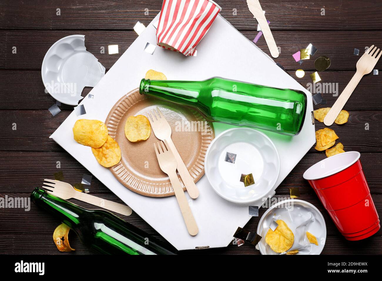 Mess after party celebration on dark background Stock Photo - Alamy