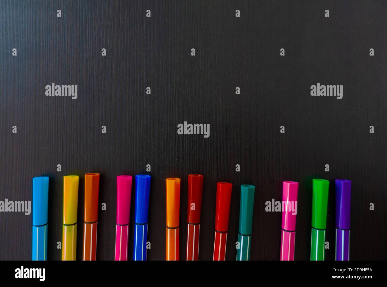 Color pen in variety color on the side on the bottom brown copy space ...