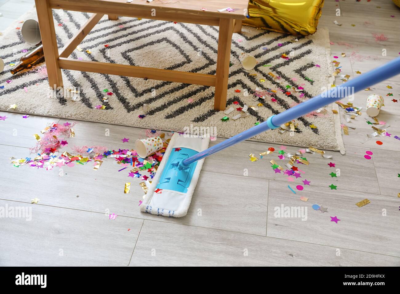 Cleaning of messy room after party celebration Stock Photo - Alamy