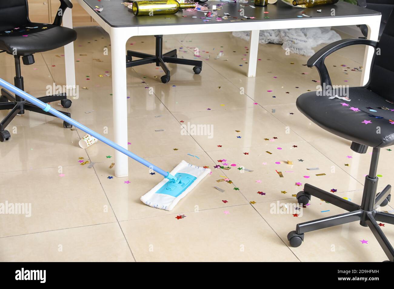 Cleaning of office after party celebration Stock Photo - Alamy