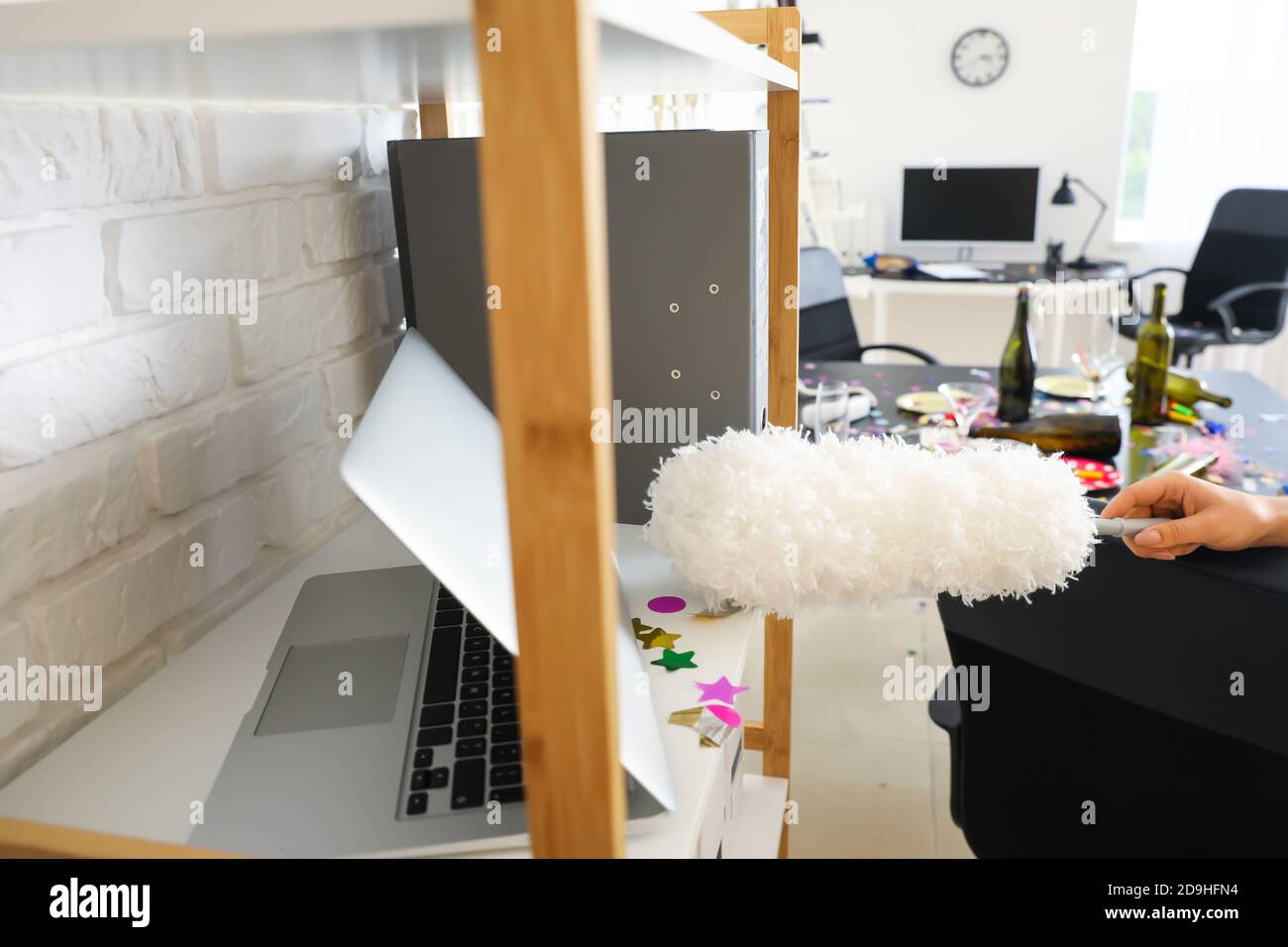 Cleaning of messy office after party Stock Photo - Alamy