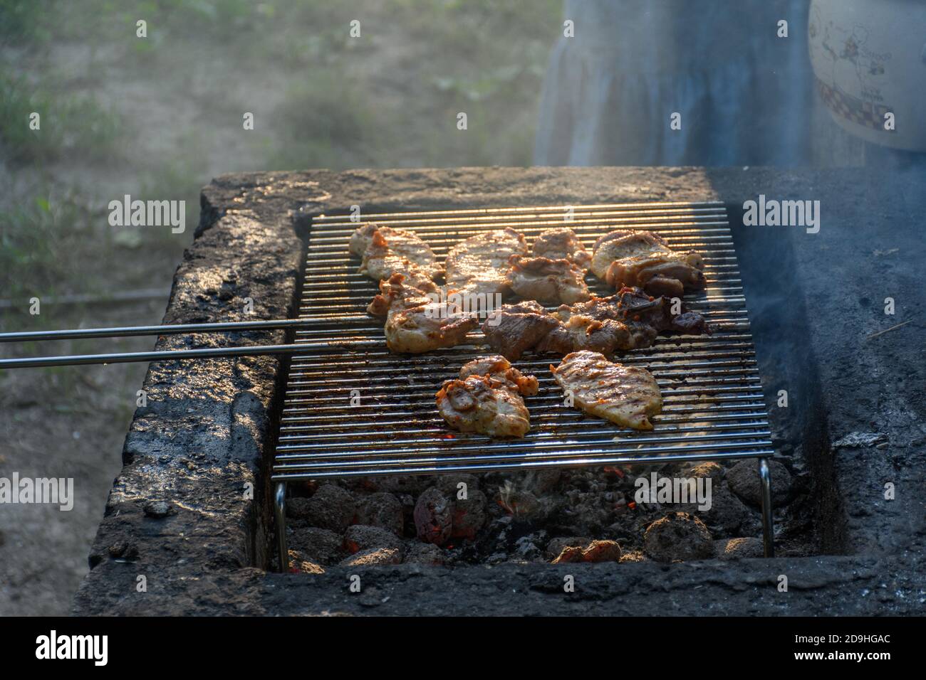 High angle shot of steaks cooking on a flaming grill Stock Photo - Alamy