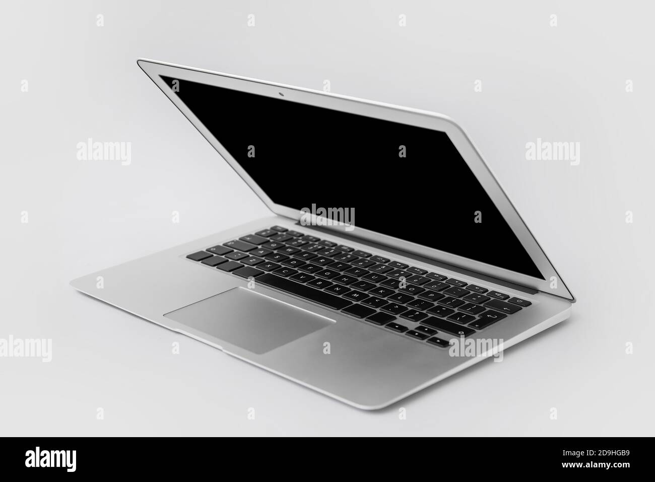 Modern laptop on grey background Stock Photo - Alamy