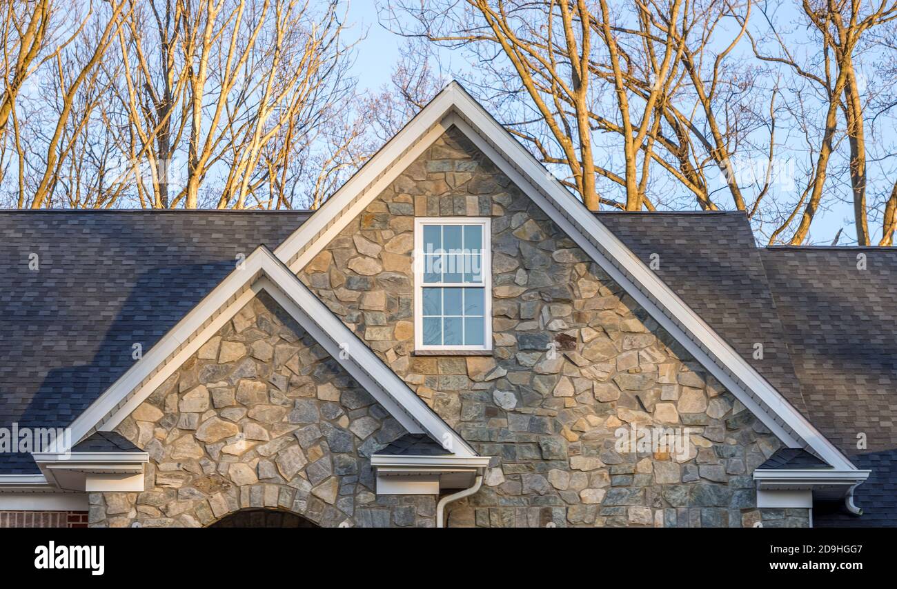 Double gable roof with attic vent or window Stock Photo - Alamy