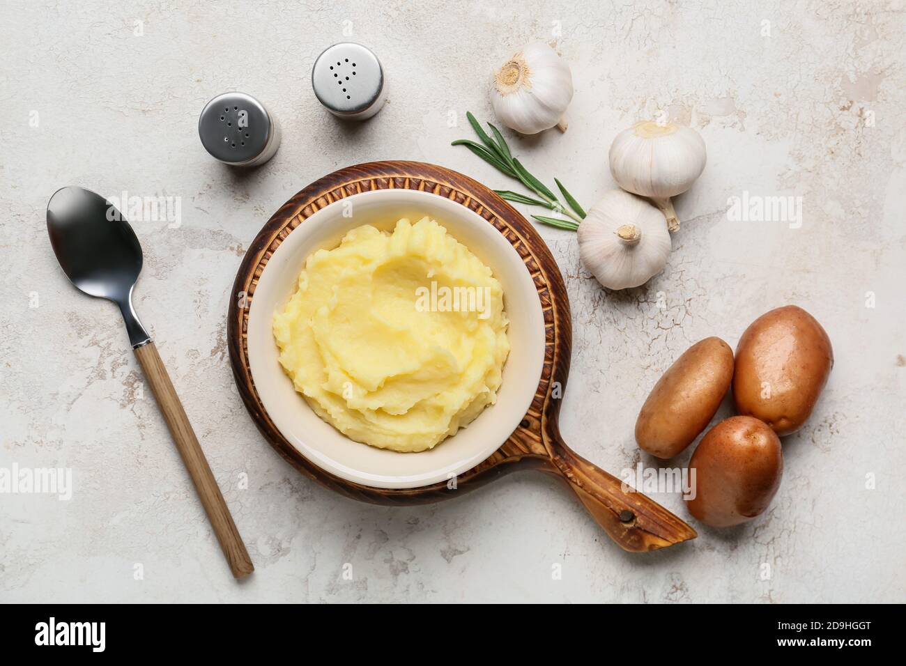 Composition with tasty mashed potato and garlic on table Stock Photo ...
