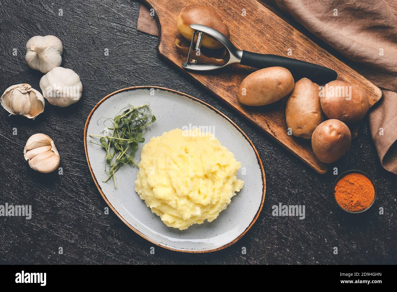 Composition with tasty mashed potato and garlic on table Stock Photo ...