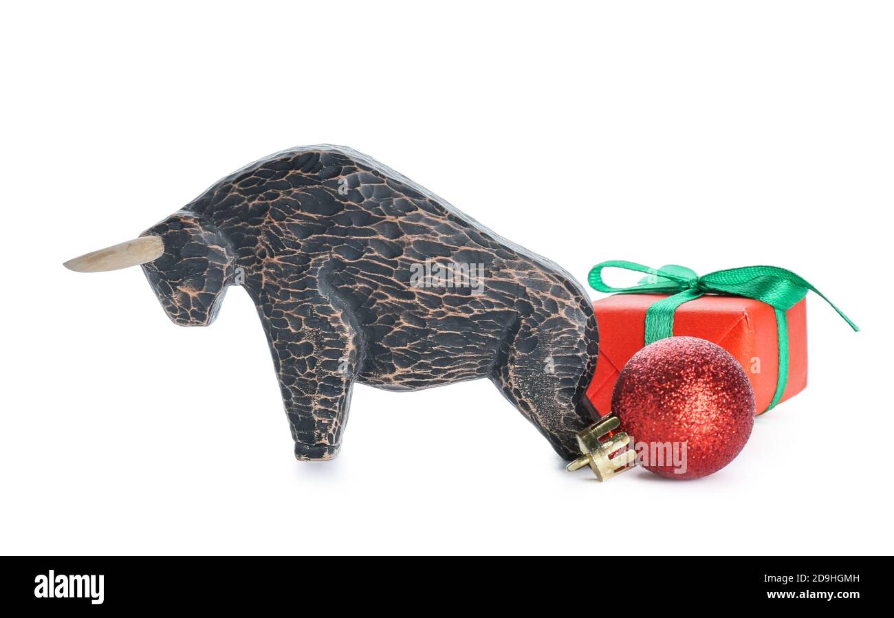 Figurine of bull, gift and New Year decor on white background Stock ...