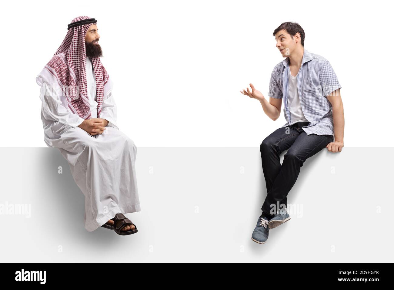 Young man and an arab sitting on a panel and talking isolated on white ...