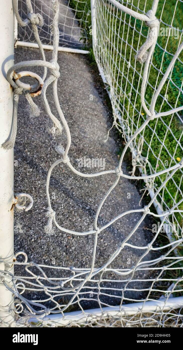 Vertical shot of a soccer net in a playground under the sunlight Stock ...
