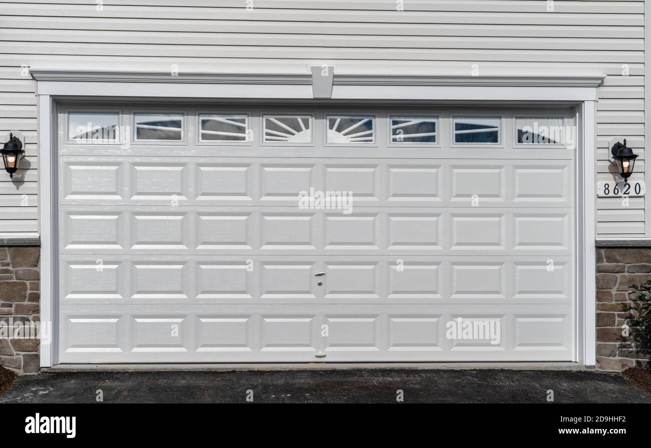 Double car classic insulated steel raised panel garage door framed with ...