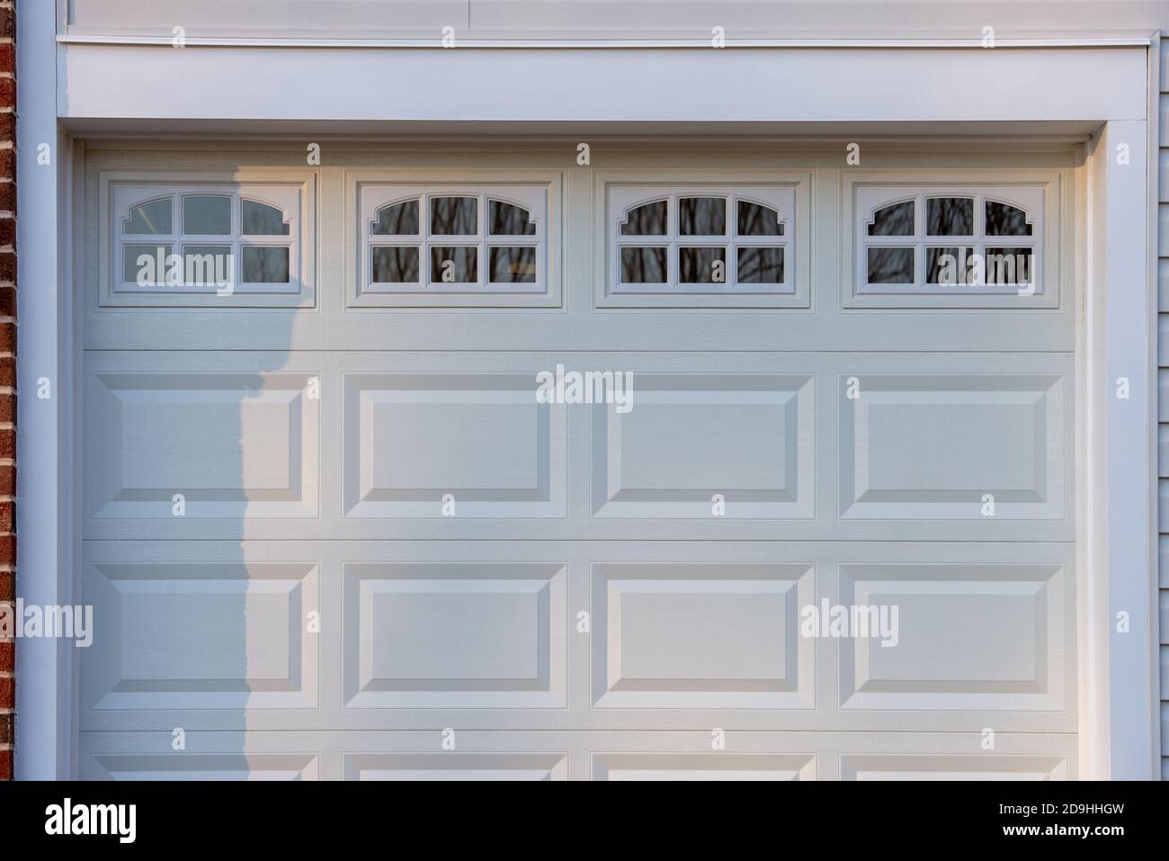 Double car classic insulated steel raised panel garage door framed with ...