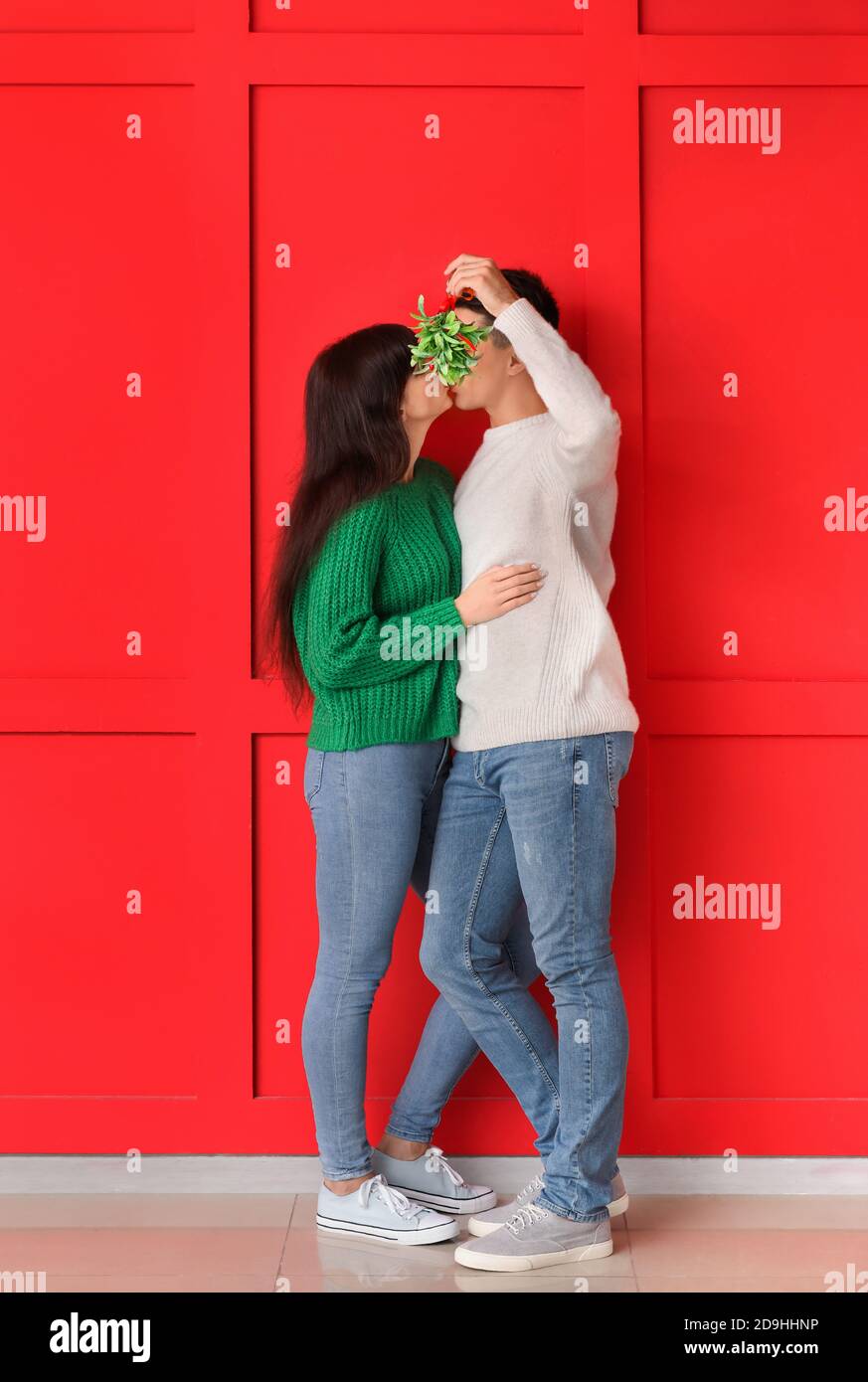 Couple Kissing Under Mistletoe High Resolution Stock Photography and ...