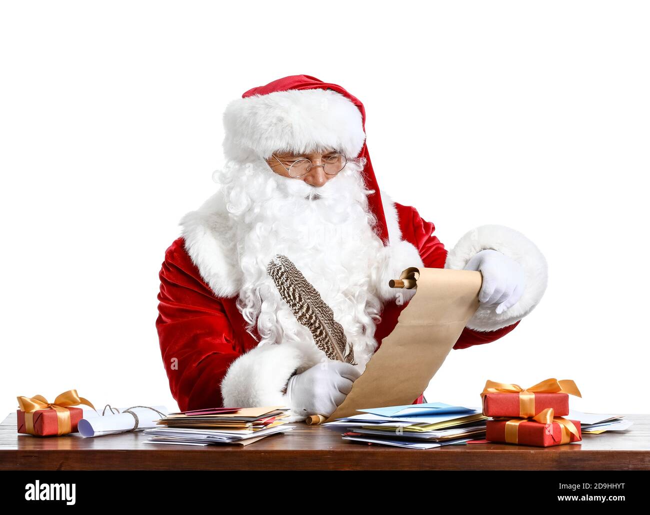 Santa Claus writing letter on white background Stock Photo - Alamy