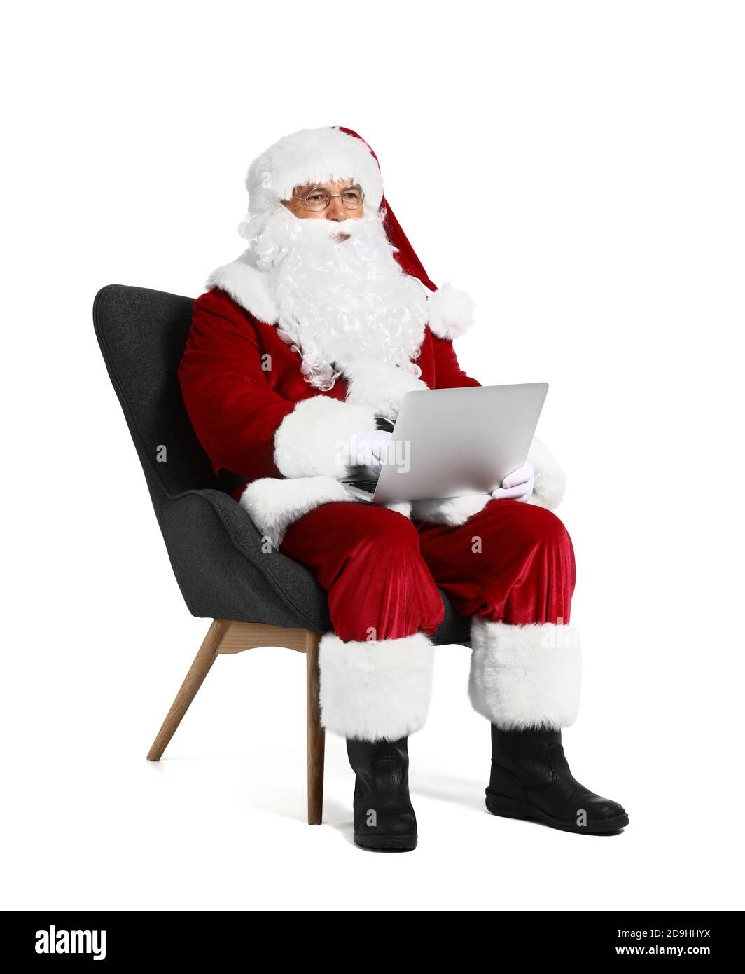 Santa Claus with laptop on white background Stock Photo - Alamy