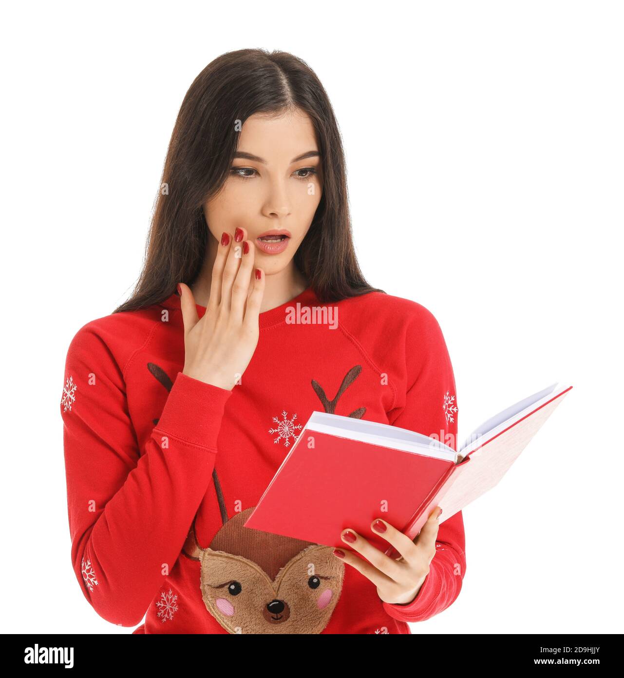 Shocked young woman with book on white background Stock Photo - Alamy