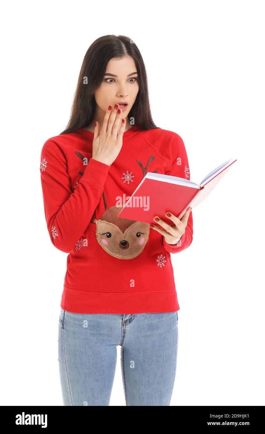 Shocked young woman with book on white background Stock Photo - Alamy