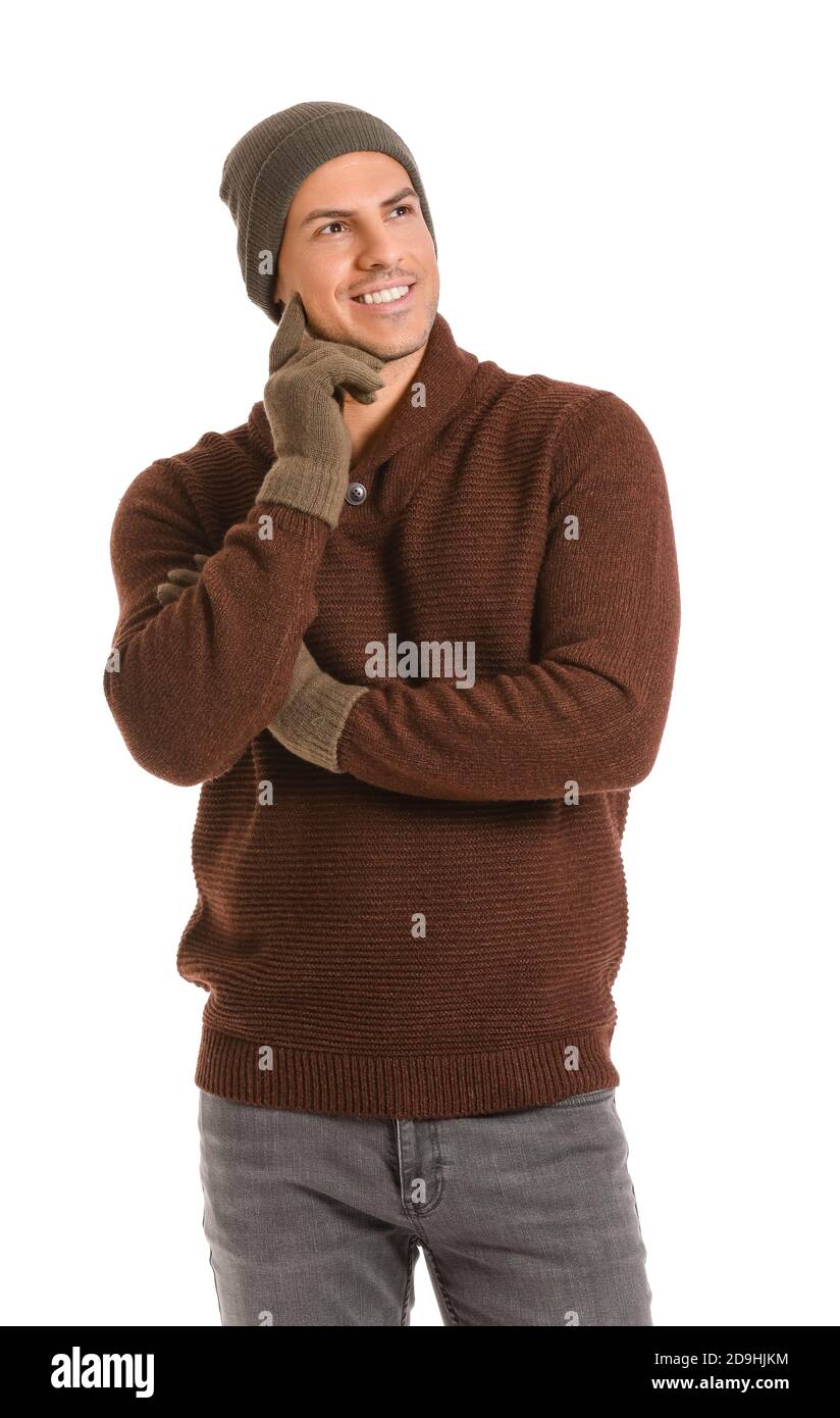 Handsome young man in winter clothes on white background Stock Photo ...
