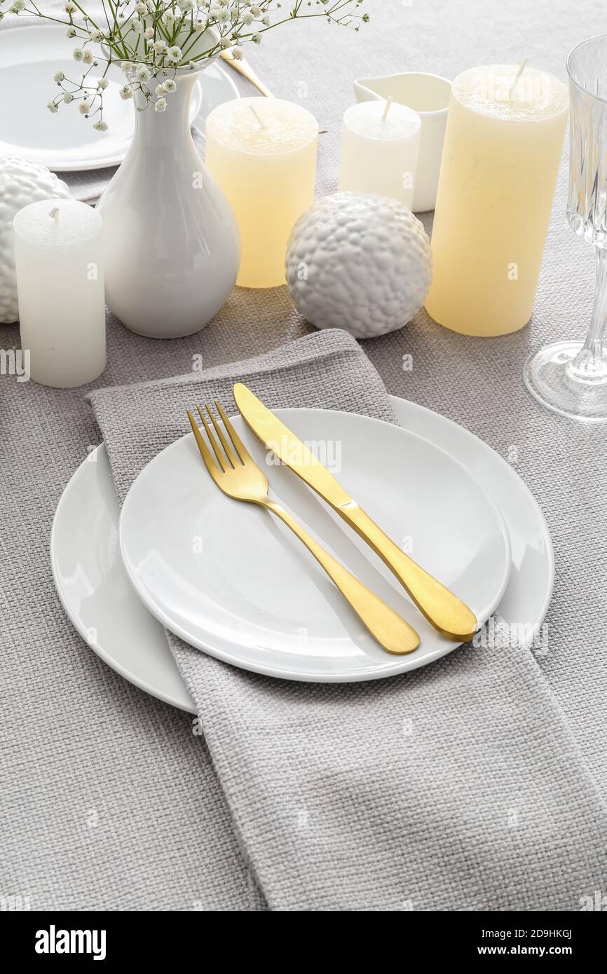 Beautiful table setting on light background Stock Photo - Alamy