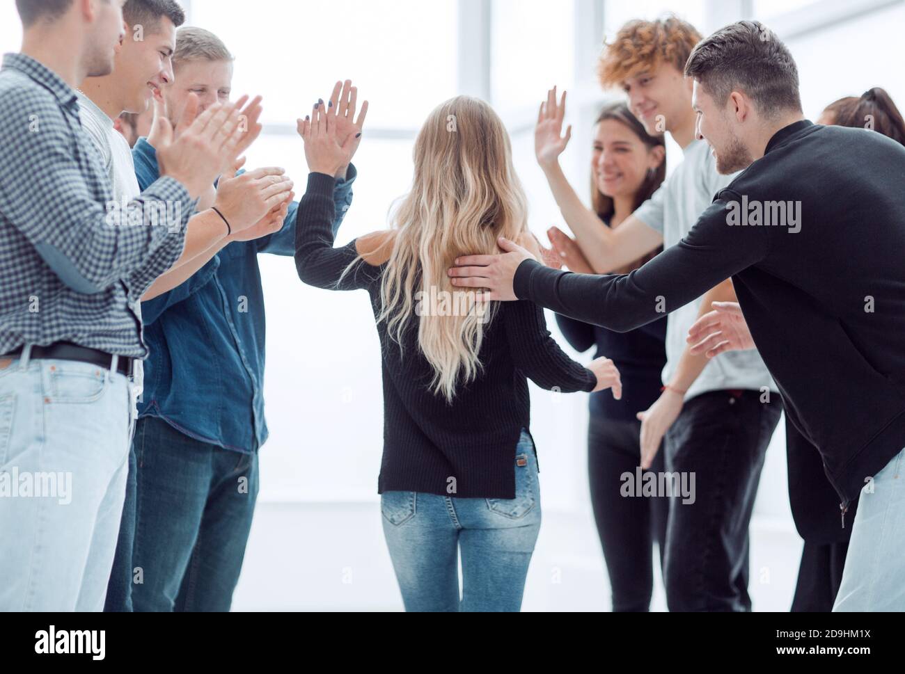 happy business team giving each other a high five Stock Photo - Alamy