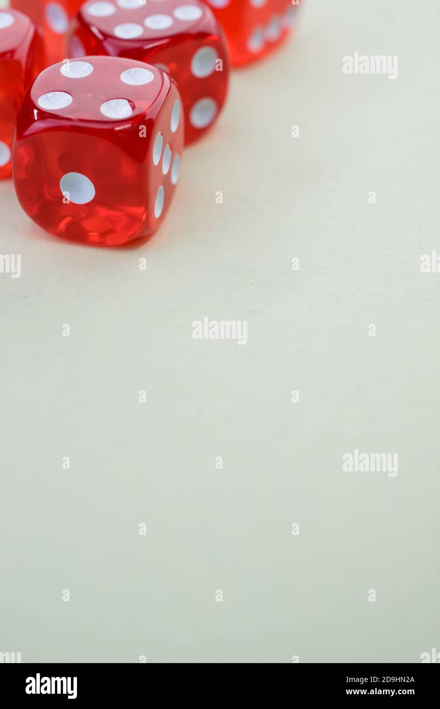 Closeup of red rolling dice on a white background Stock Photo - Alamy
