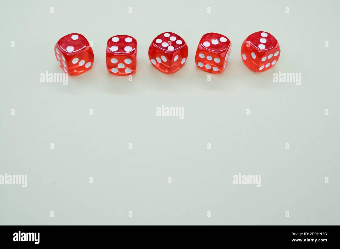 High angle shot of playing dice on an isolated gray background Stock ...