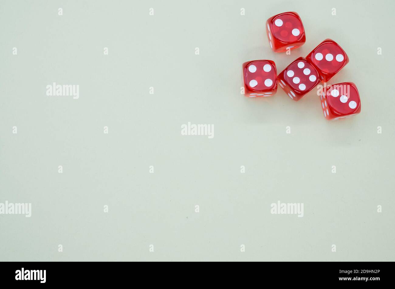 Closeup of red rolling dice on a white background Stock Photo - Alamy