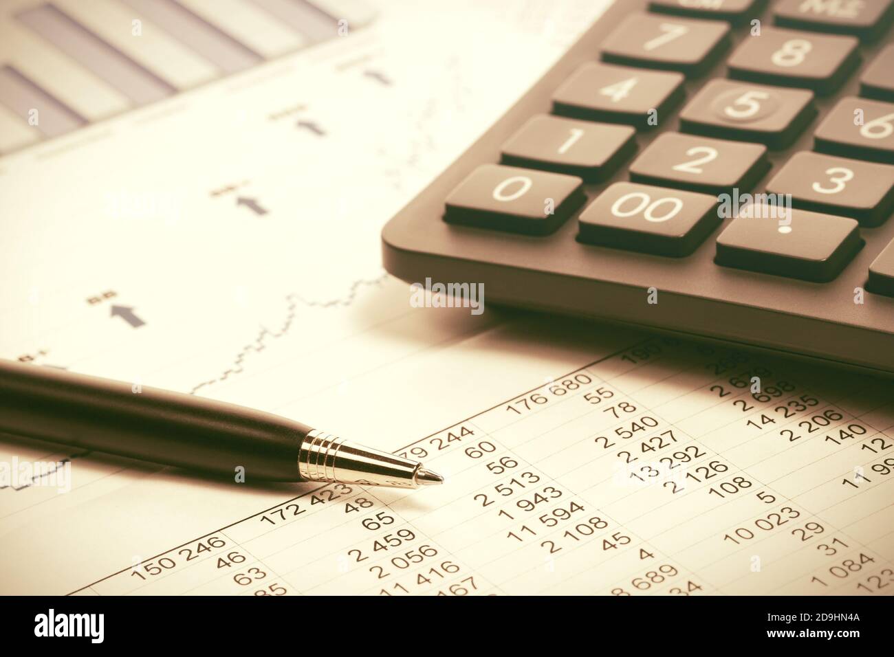 Financial accounting Pen and calculator on balance sheets Stock Photo ...