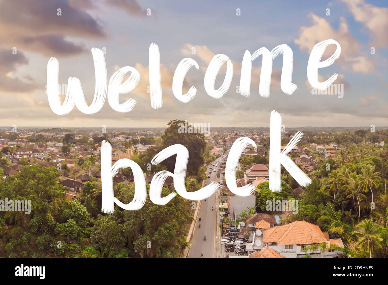 Welcome back to bali. Many villas with brown-orange shingle roofs ...