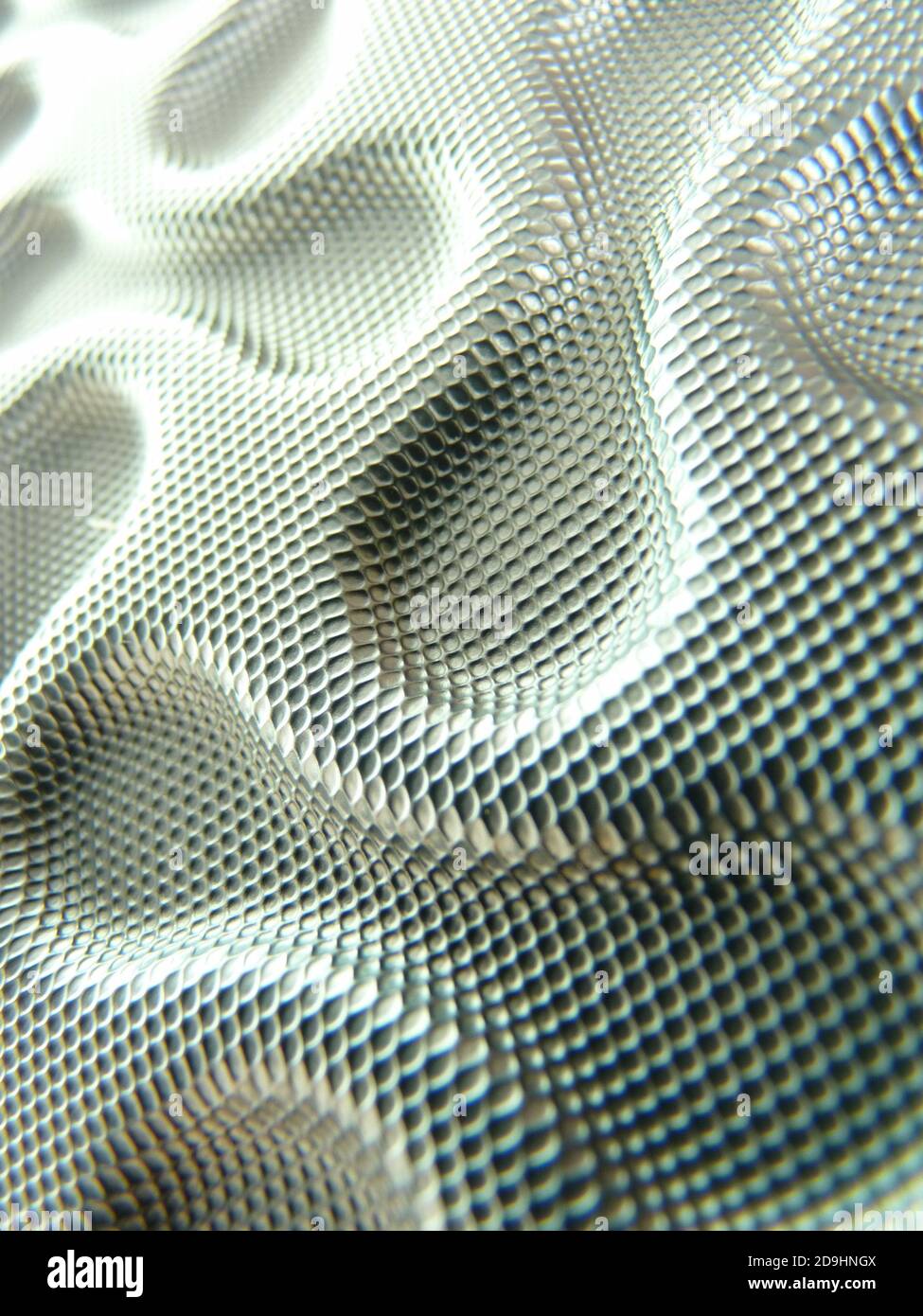 Vertical 3D rendering of a silver metal surface with decorative ...