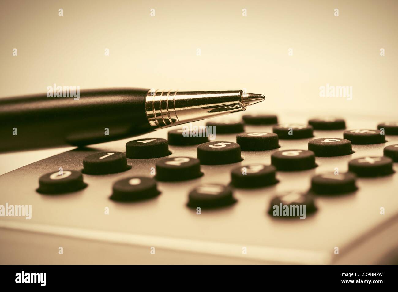 Financial accounting pen on calculator Stock Photo - Alamy