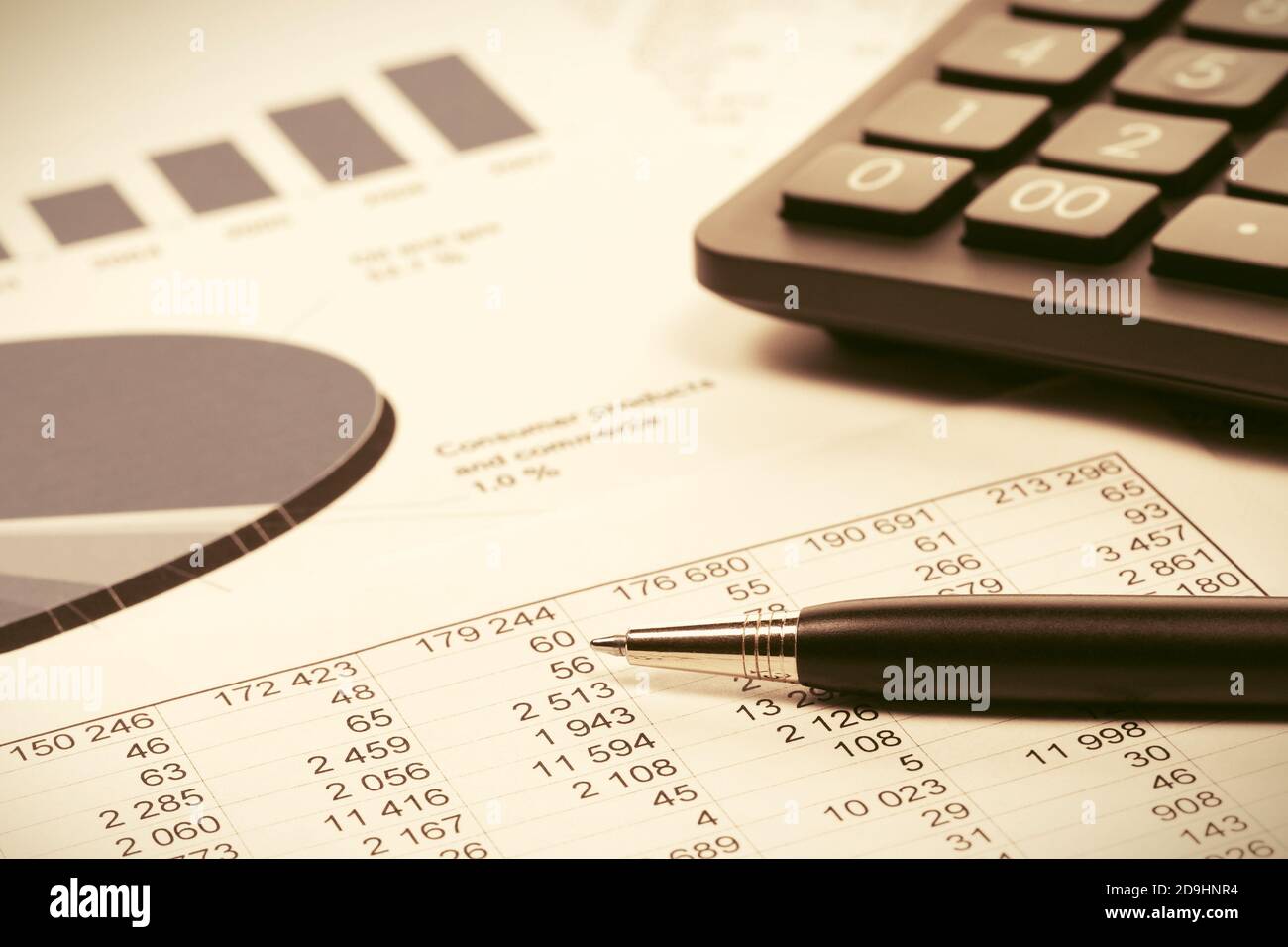 Financial accounting Pen and calculator on balance sheets Stock Photo ...