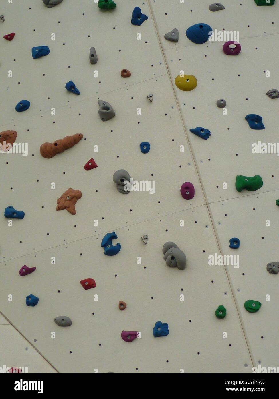 Vertical low angle shot of an artificial rock climbing practice range ...