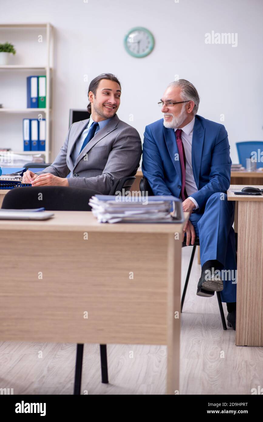 Two employees working in the office Stock Photo - Alamy