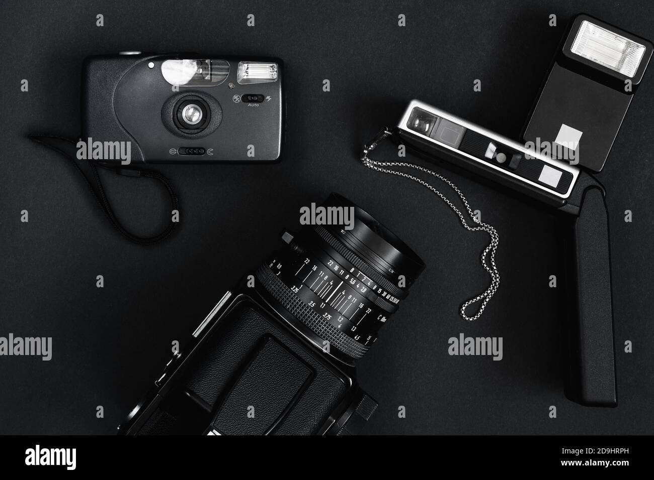 Top view of different cameras with flash on a black surface Stock Photo ...