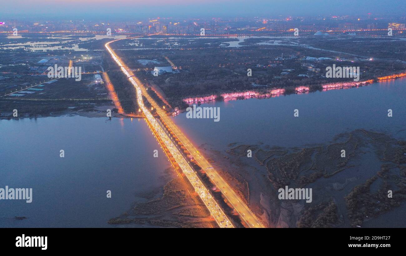 An aerial view of vehicles moving on the Songhua River Highway Bridge ...