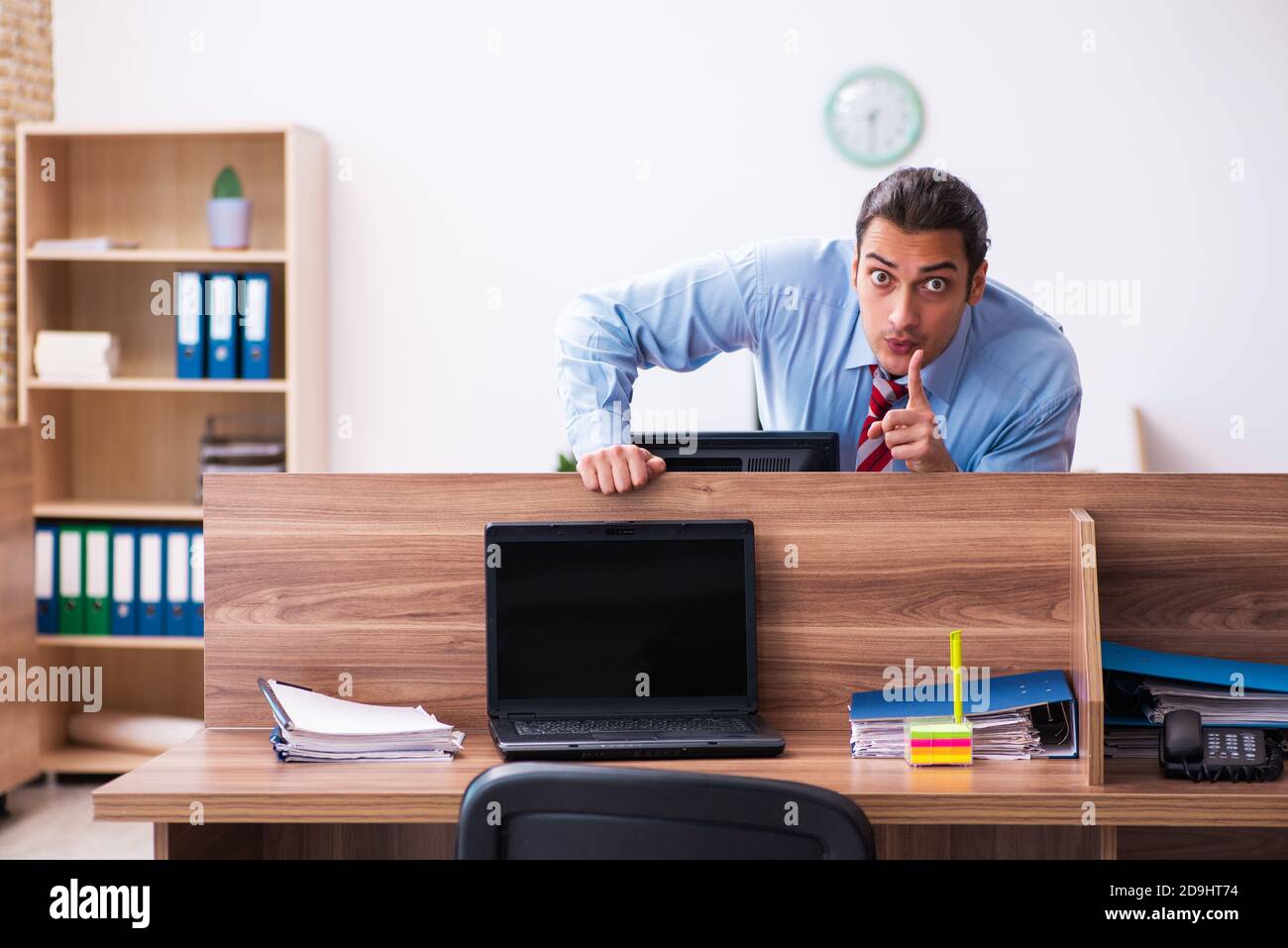 Male employee in industrial espionage concept Stock Photo - Alamy