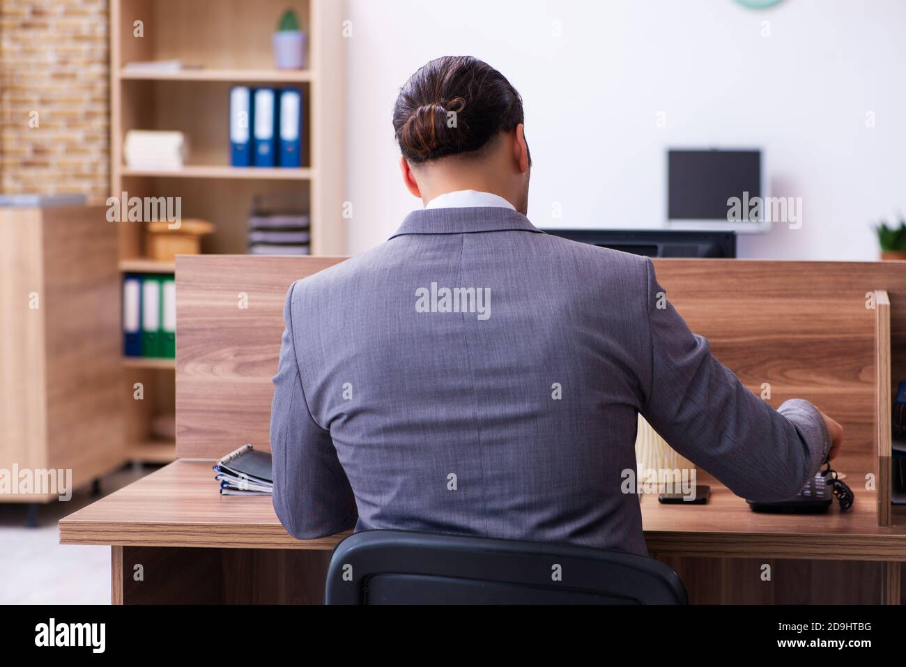 Male employee working in the office Stock Photo - Alamy