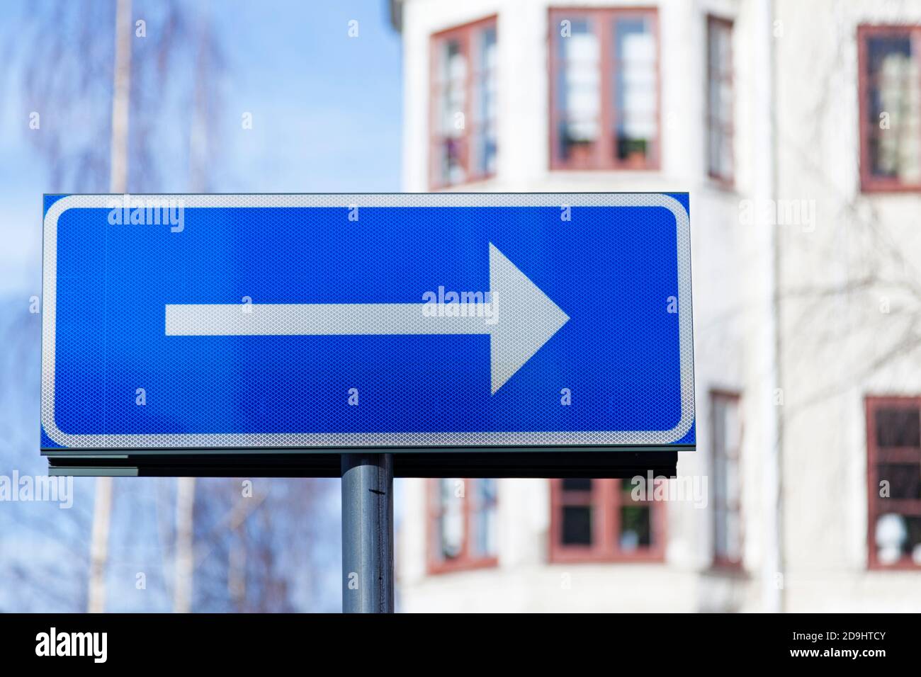 road sign meaning one-way direction Stock Photo - Alamy