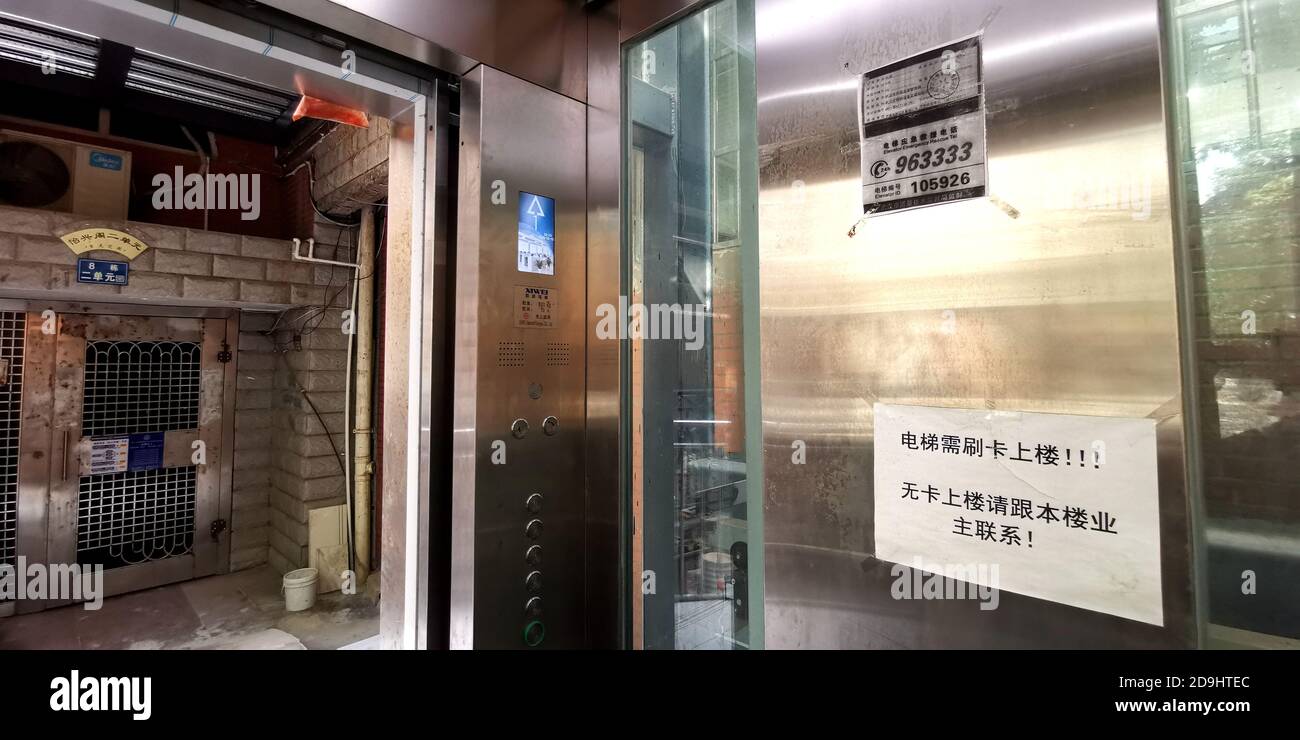 An elevator is built on the outside of an old apartment building to ...
