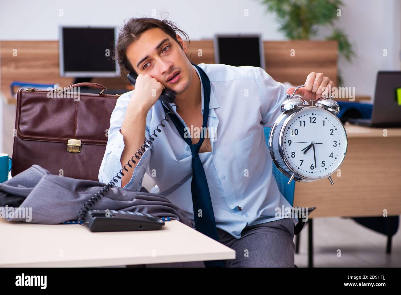Male employee being late for his job Stock Photo - Alamy