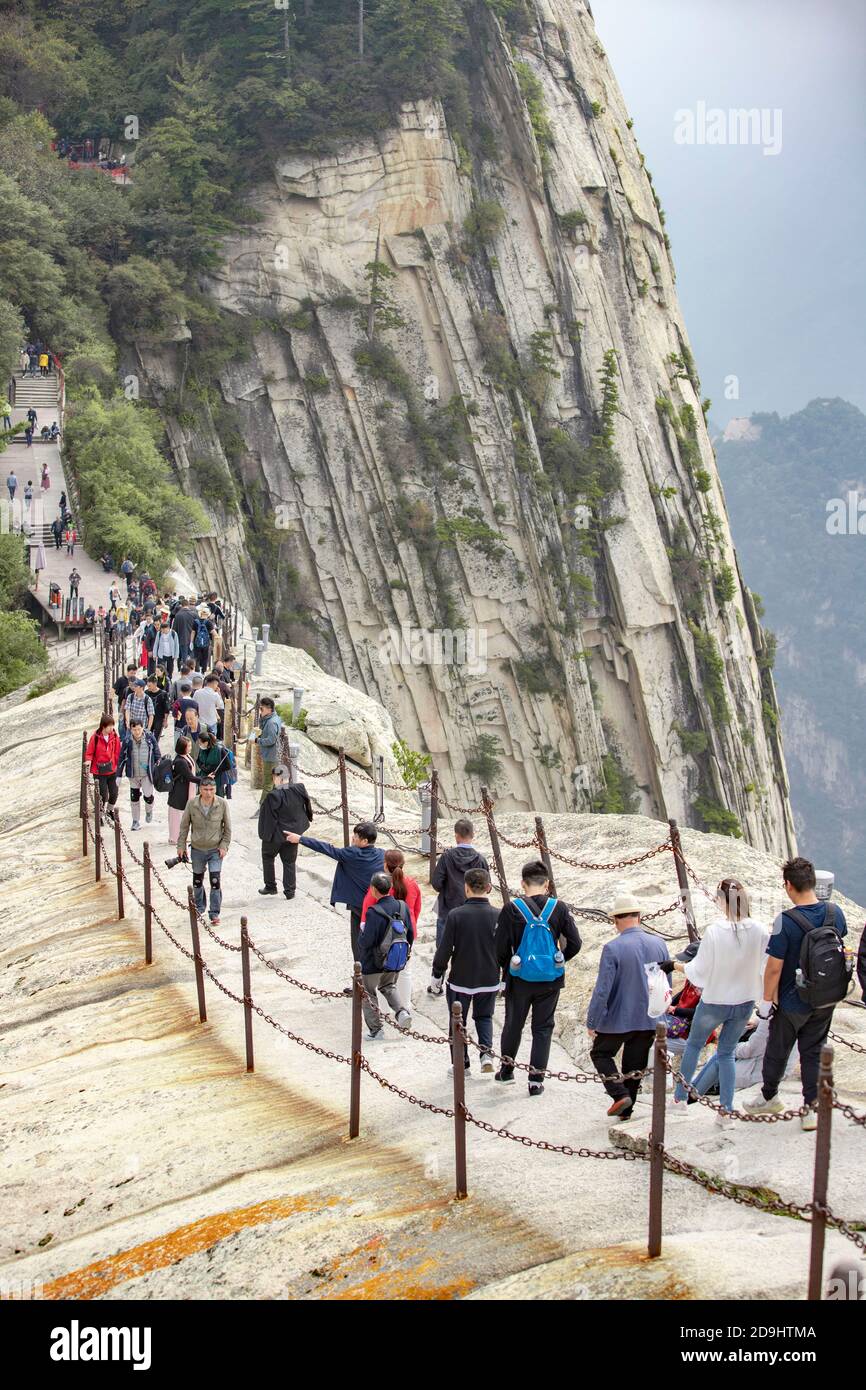 Tourists climb the Mount Hua, the western mountain of the Five Great ...